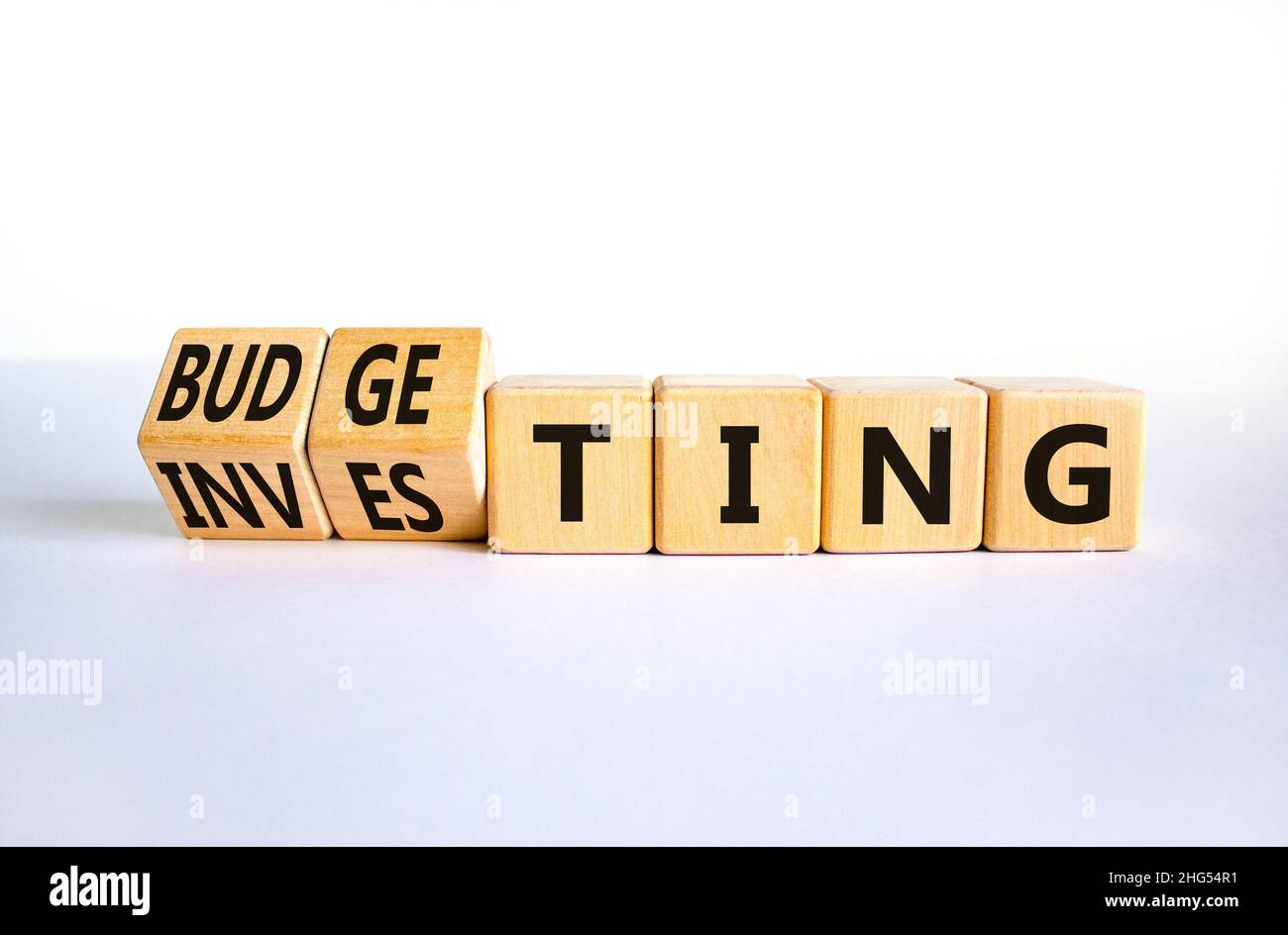 Budgeting or investing symbol. Turned wooden cubes and changed the word ...