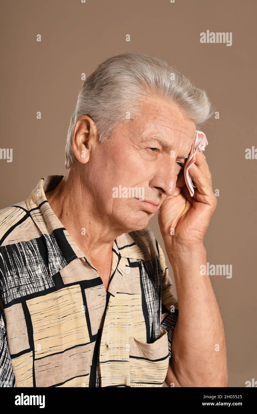 Portrait of sad sick senior man with headache Stock Photo - Alamy