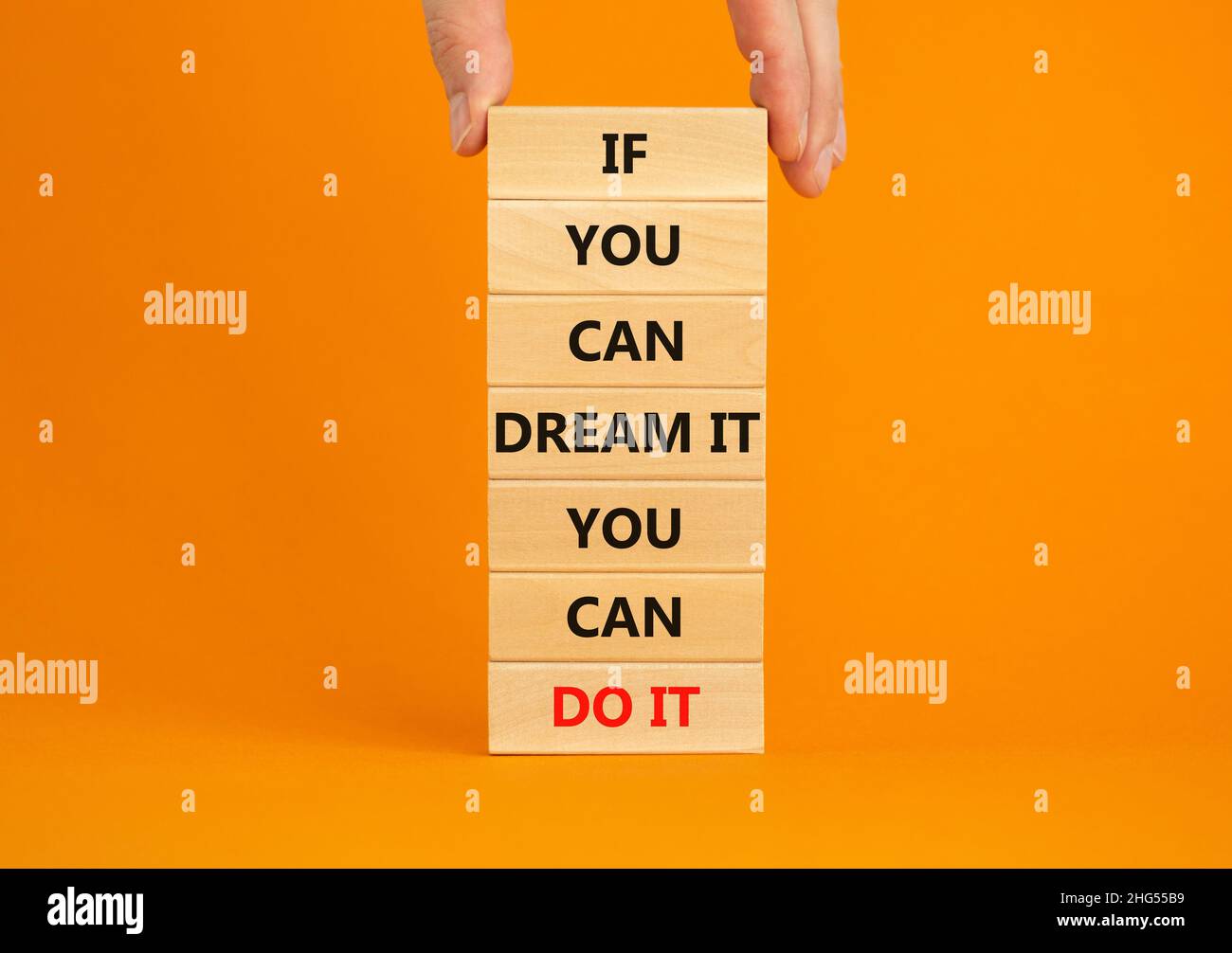 Dream and do it symbol. Wooden blocks with words If you can dream it ...