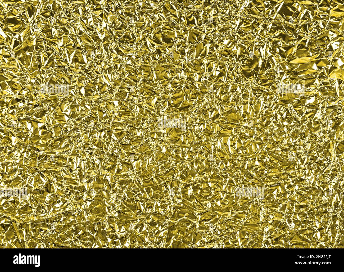 Crumpled golden aluminum foil as a background Stock Photo - Alamy