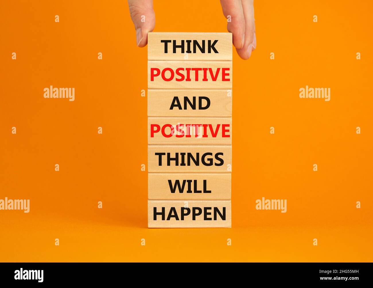 Think positive symbol. Wooden blocks with words Think positive and ...