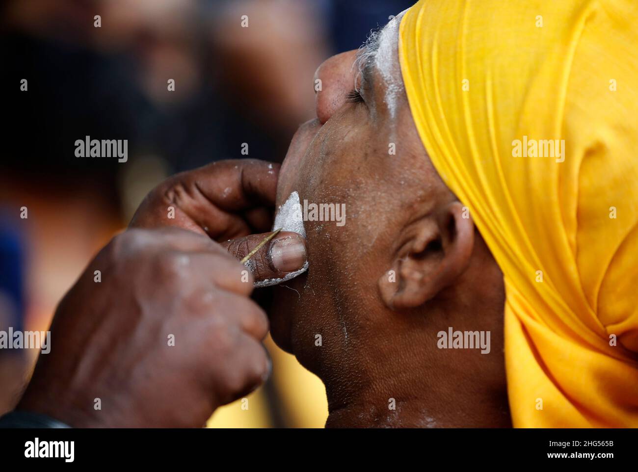 Kuala Lumpur, Malaysia. 18th Jan, 2022. A Hindu devotee gets his mouth ...