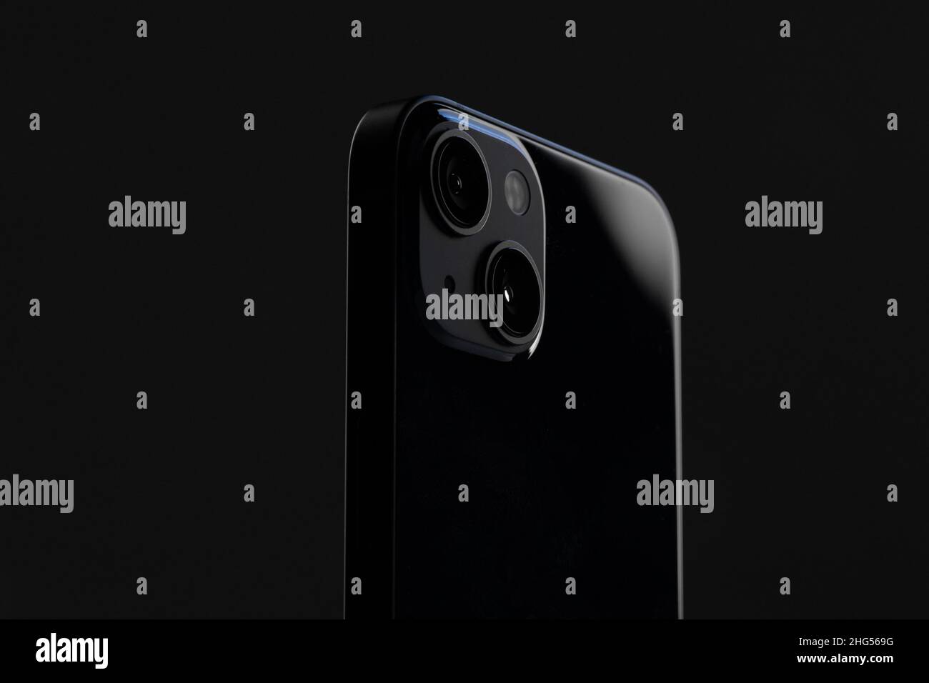 back of a Black modern smartphone with two large cameras on a black ...