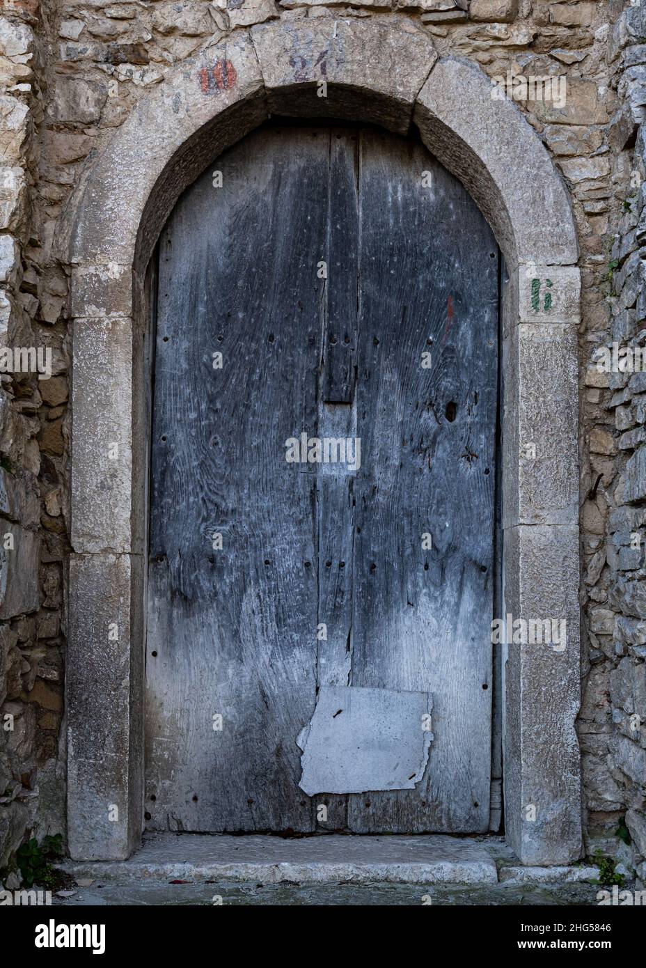 ancient gate of an abandoned stone building Stock Photo - Alamy