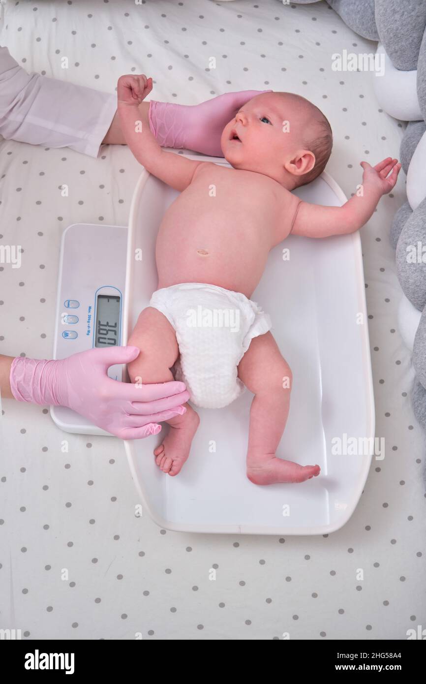 Child weighing scale clinic hi-res stock photography and images - Alamy