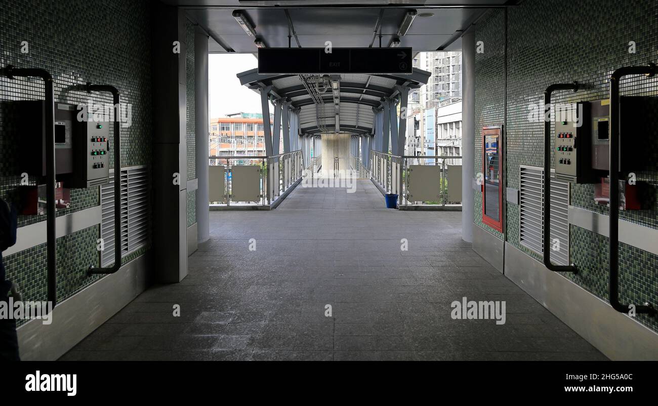 Pedestrian pathway or corridor or hallway between train station and ...