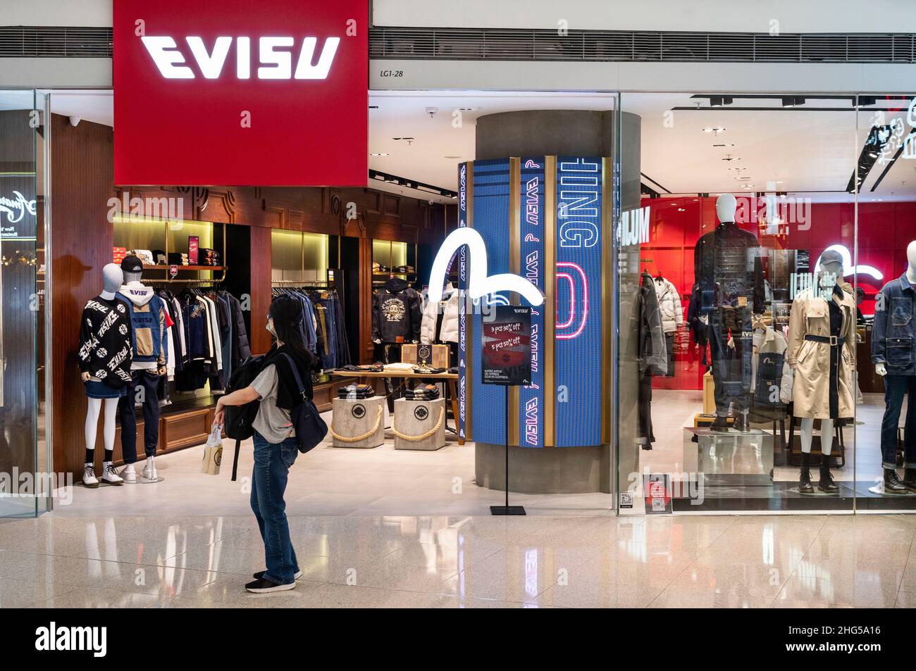Hong Kong, China. 9th Jan, 2022. A shopper walks past the Japanese ...