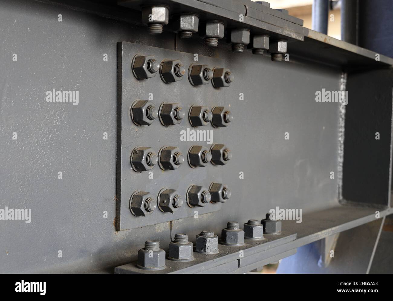 Metal supports Bolts, nuts, threaded on beams of the Steel Construction ...
