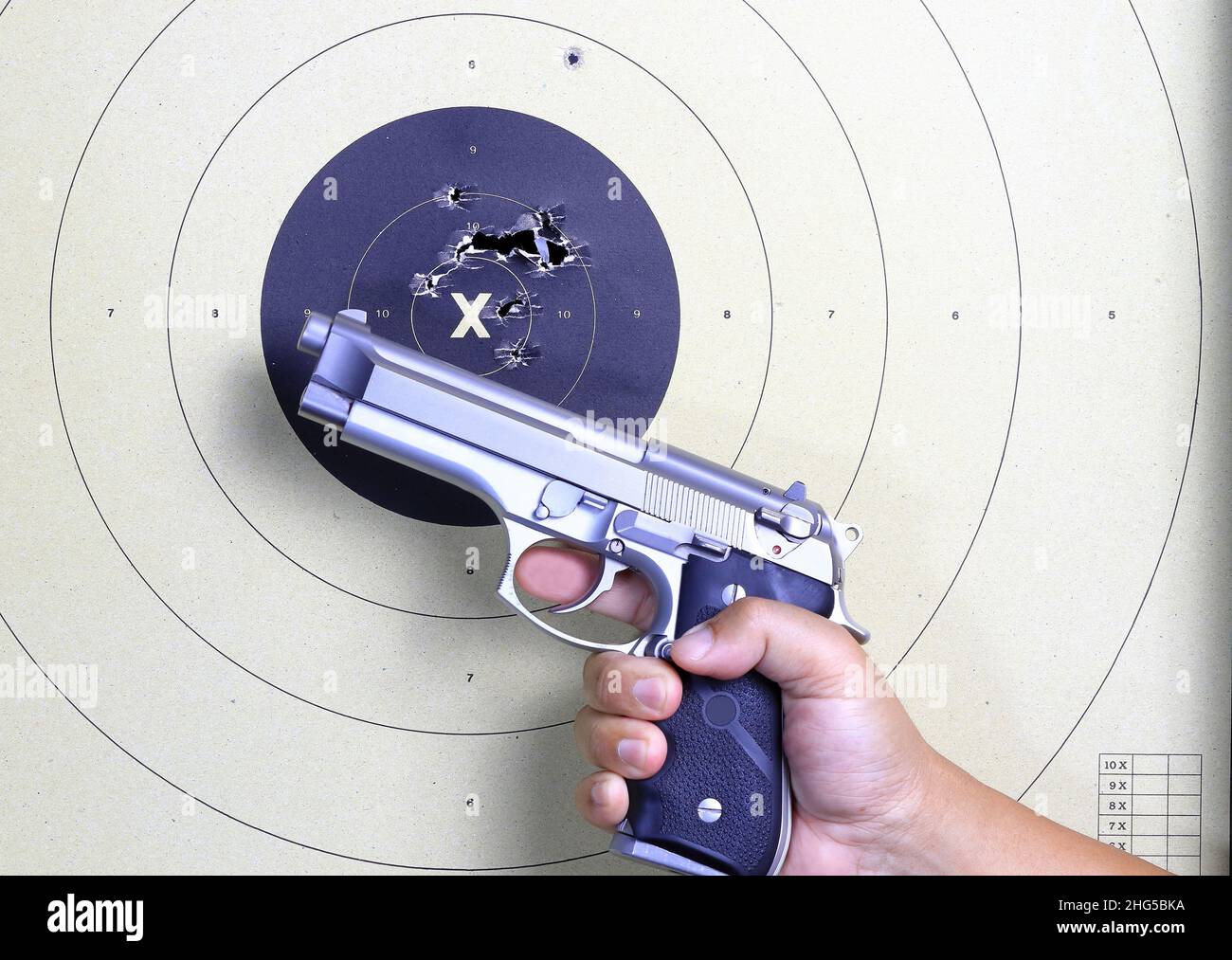 Gun and shooting target With Bullet Holes. Classic Paper Shooting ...