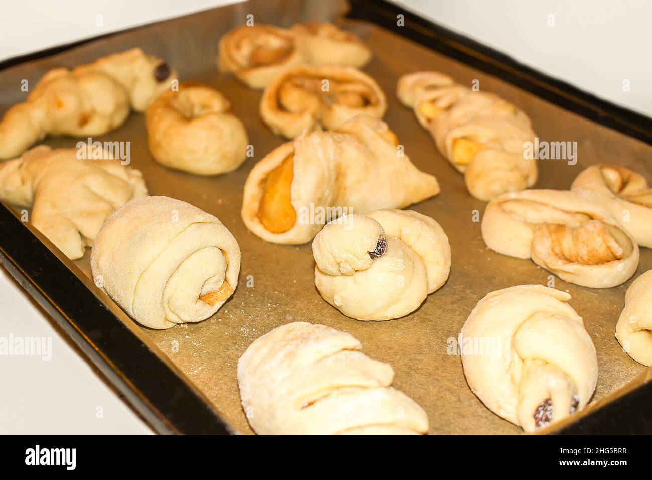 Raw unbaked buns. Cooking process. Traditional pastry Stock Photo - Alamy