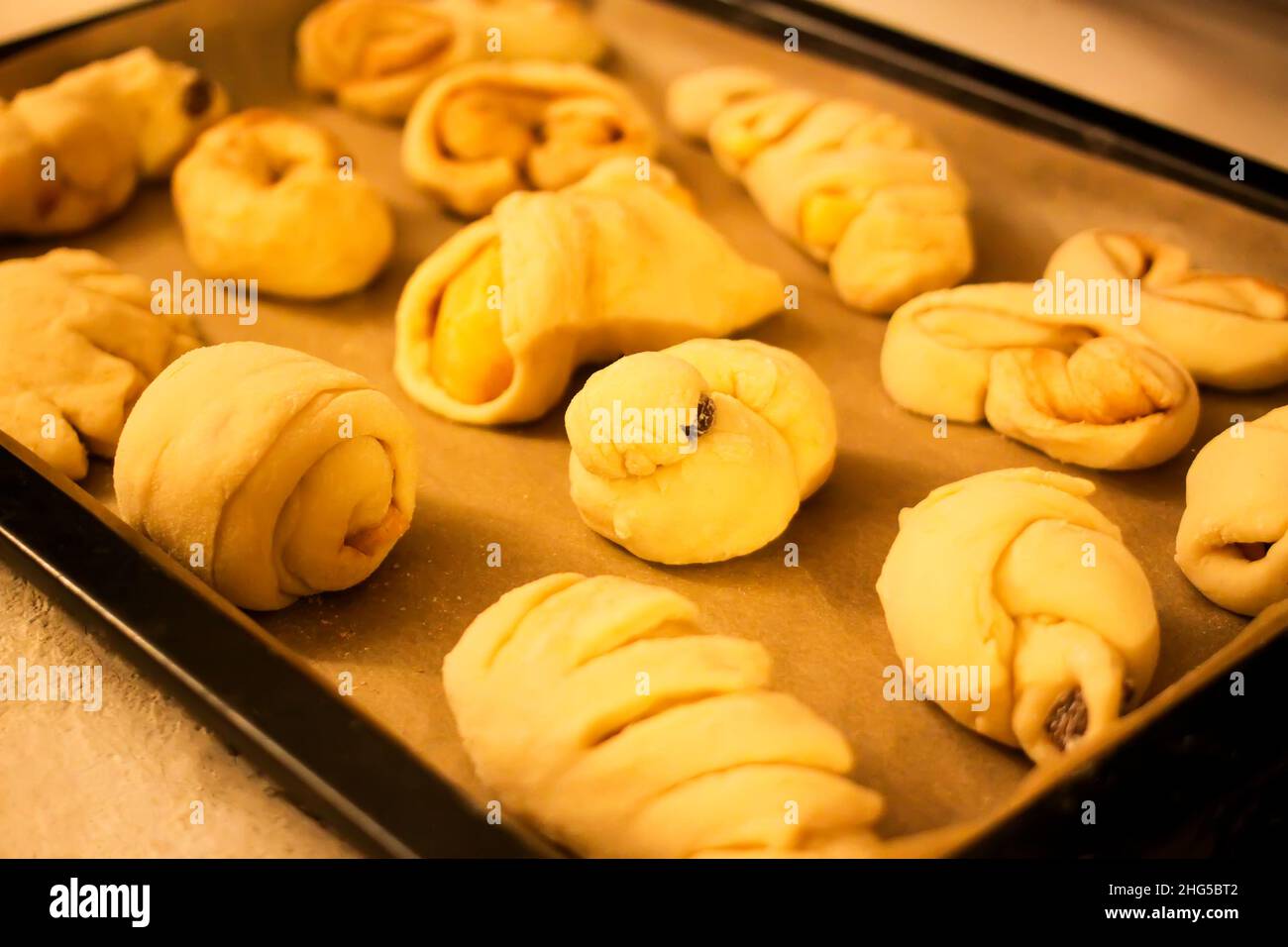 Raw unbaked buns. Cooking process. Traditional pastry Stock Photo - Alamy