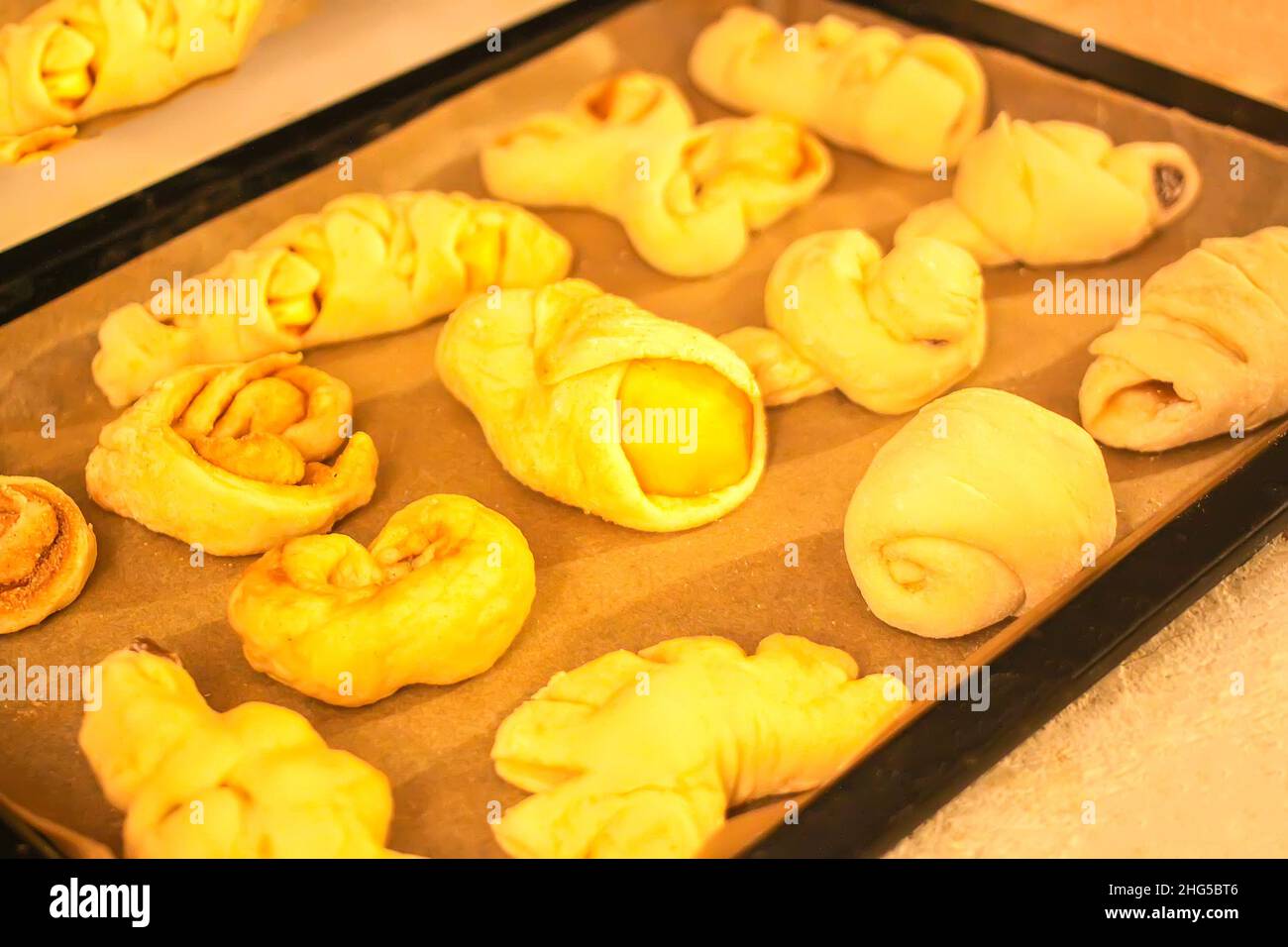 Raw unbaked buns. Cooking process. Traditional pastry Stock Photo - Alamy