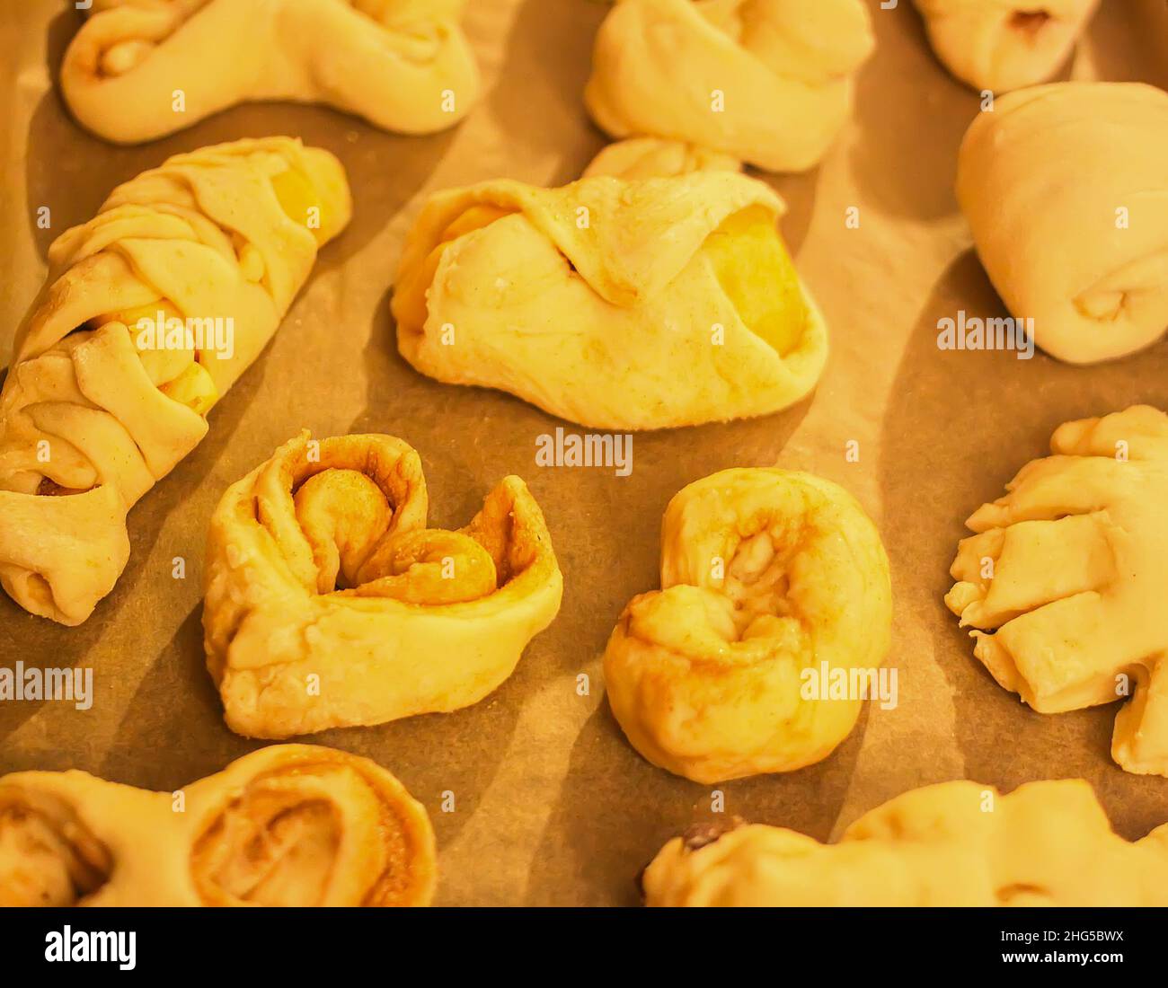 Raw unbaked buns. Cooking process. Traditional pastry Stock Photo - Alamy