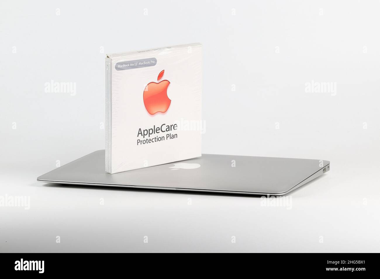 AppleCare Protection Plan service box and laptop Computer isolated on ...