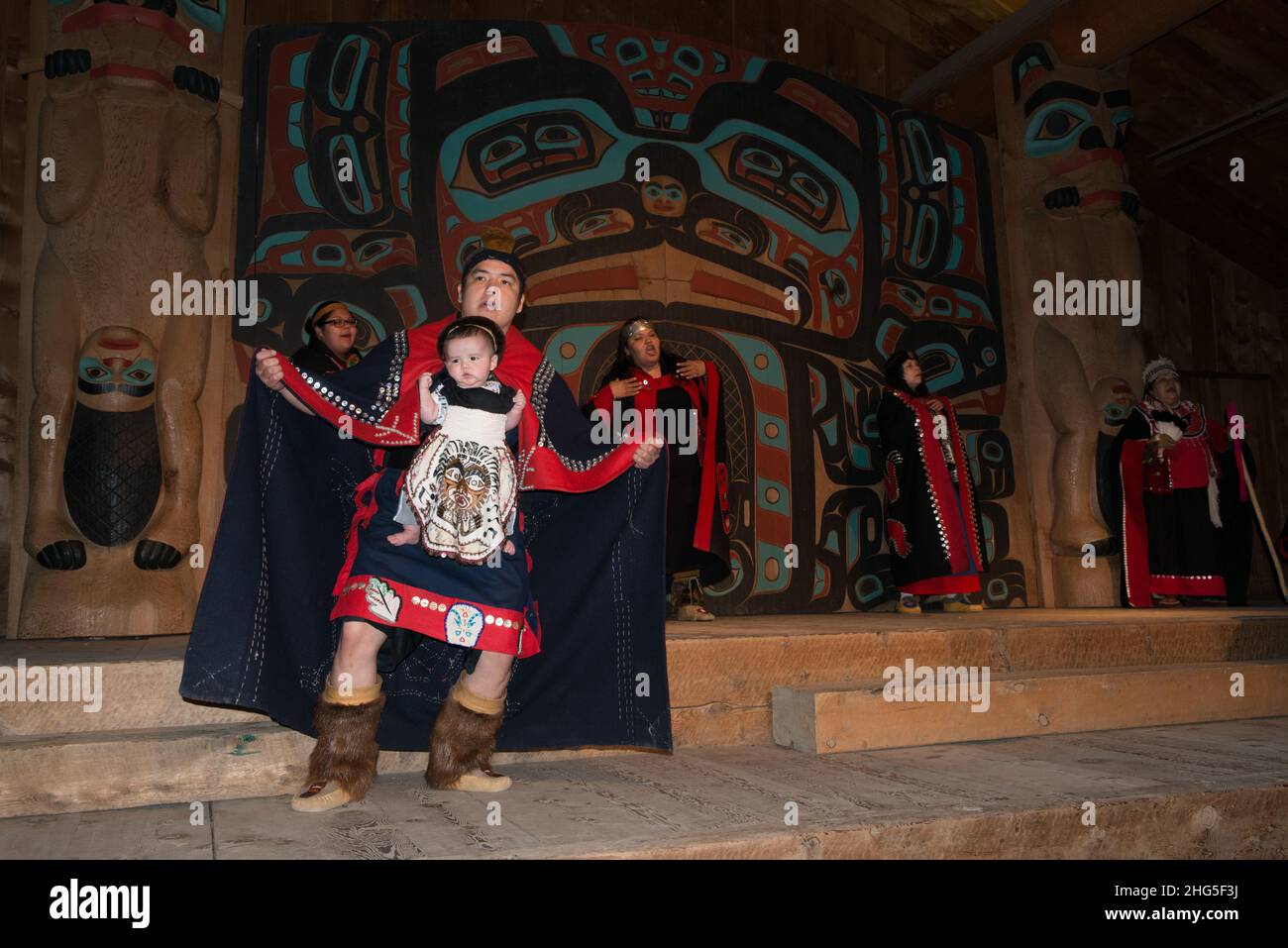 A Saxman tribal member dances for an audience of tourists with his ...