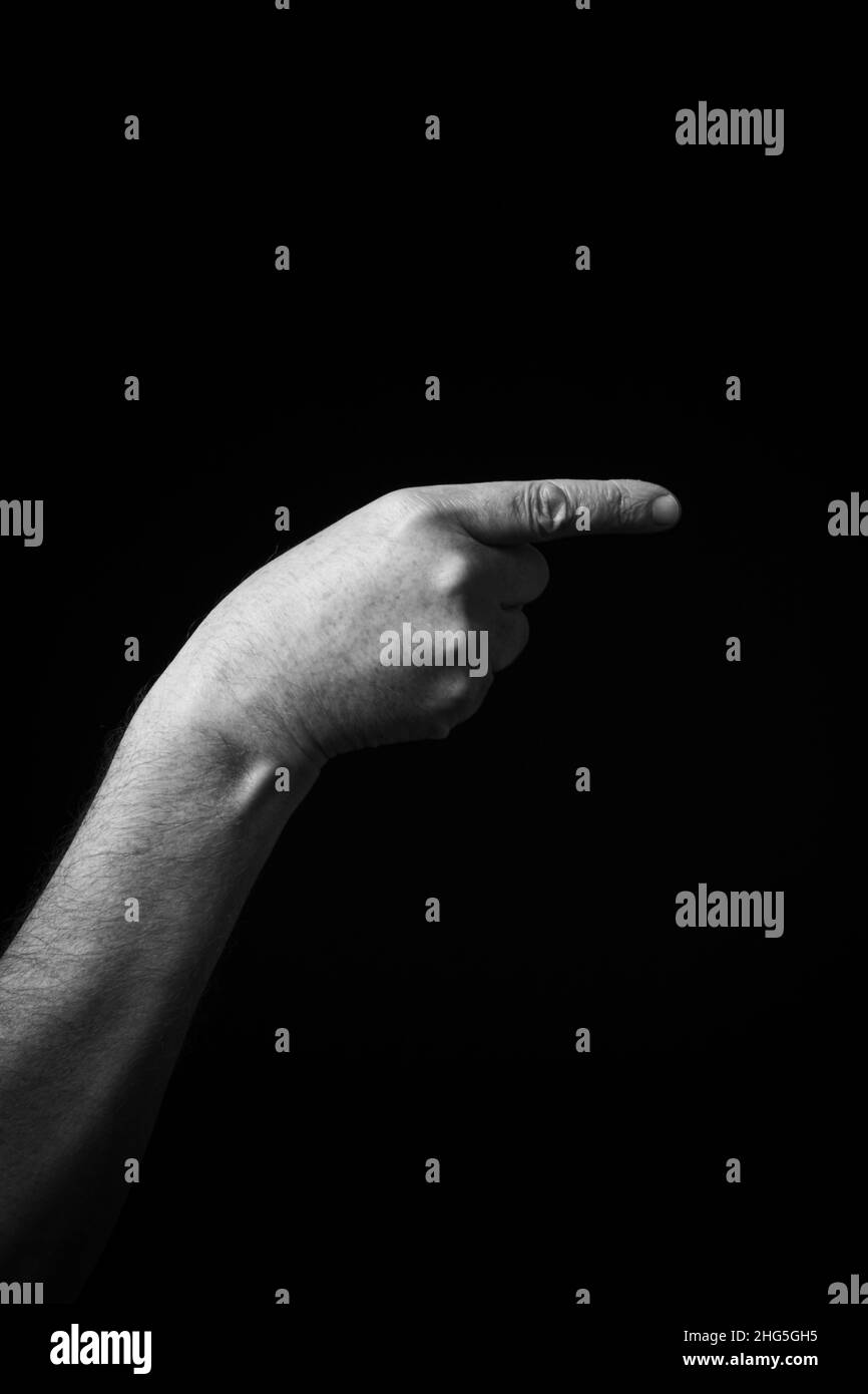 Dramatic B+W image of male hand fingerspelling CSL Chinese sign ...