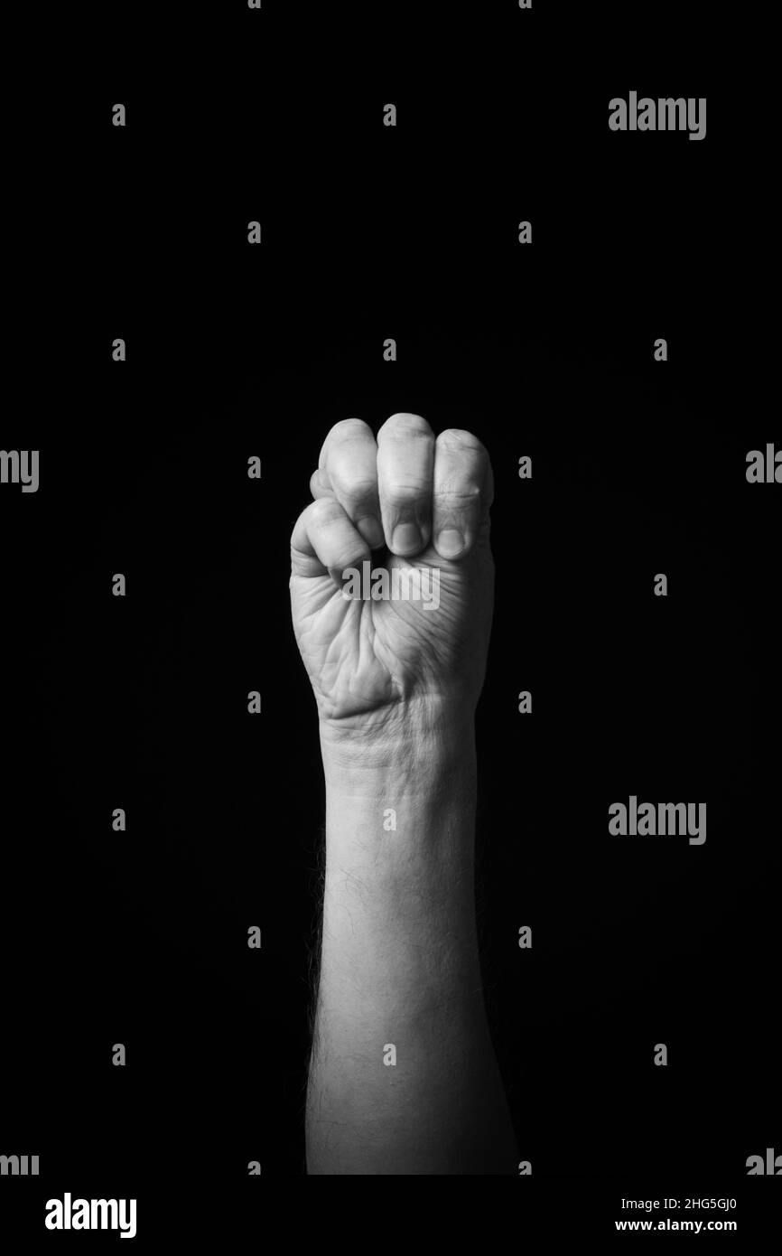 Dramatic B+W image of male hand fingerspelling CSL Chinese sign ...
