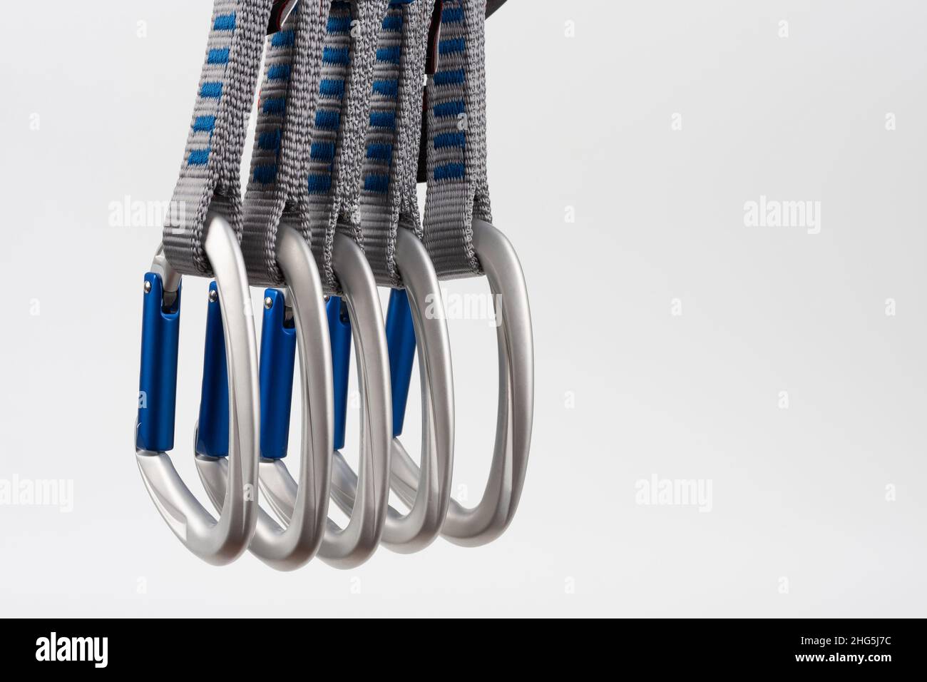 Five quick draws, carabiners with straight gate on white background ...