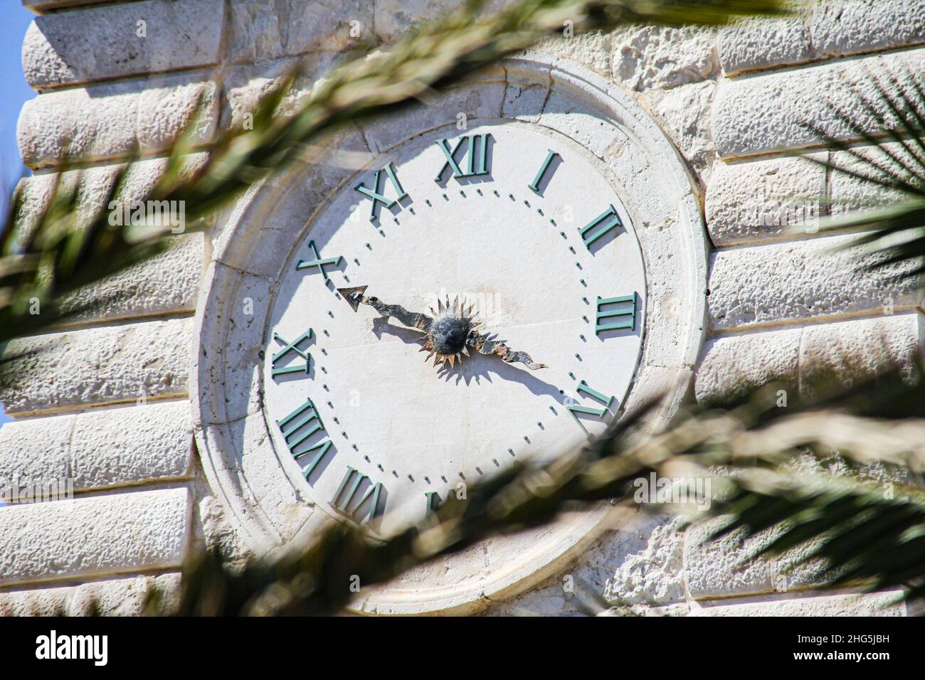 detail of ancient stone clock on granite tower. Trani, Puglia, Italy ...