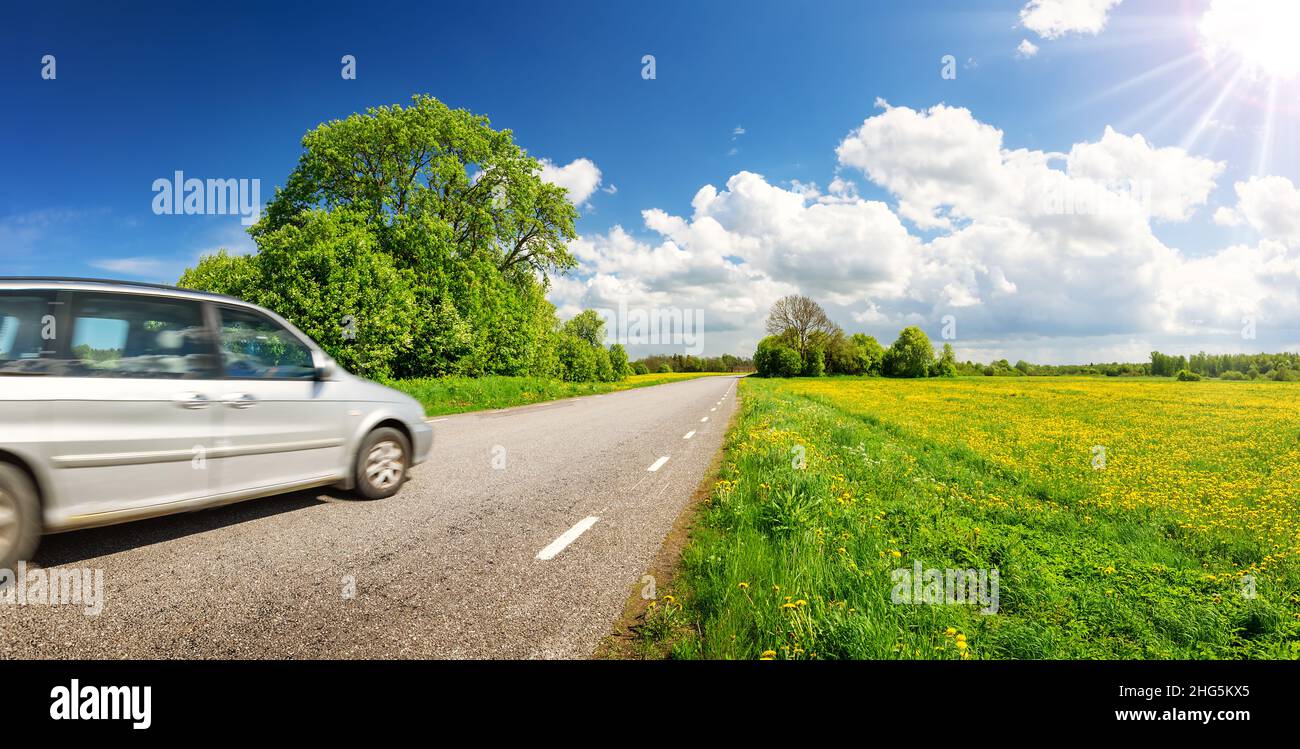 Panoramic view of the asphalt road with car on it Stock Photo - Alamy