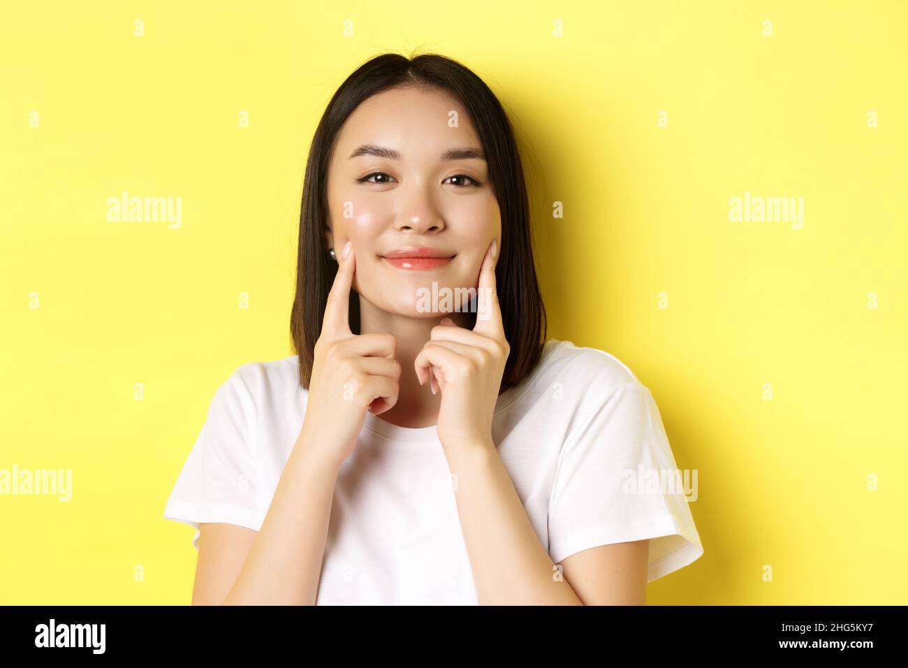 Beauty and skincare. Close up of young asian woman with short dark hair ...