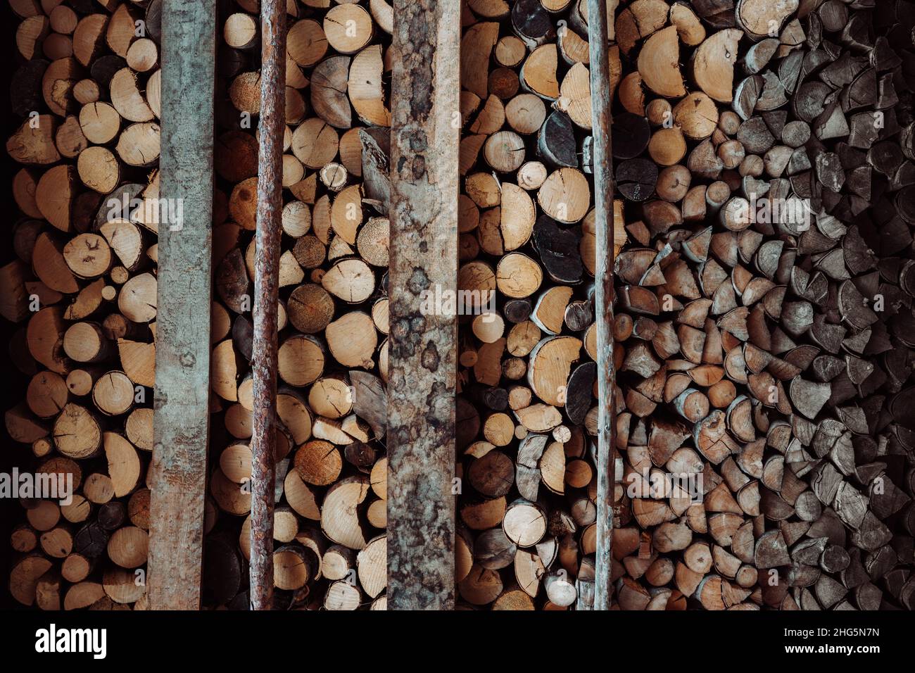 Wood natural sawn logs as background. Stacked wall wood logs. Stacked ...