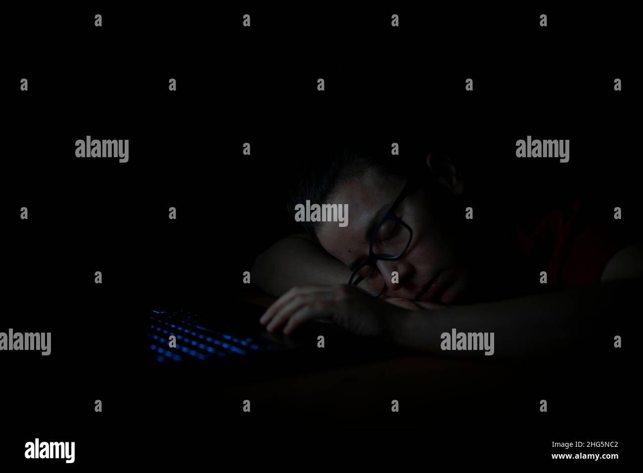 Sleeping in front of a computer Stock Photo - Alamy