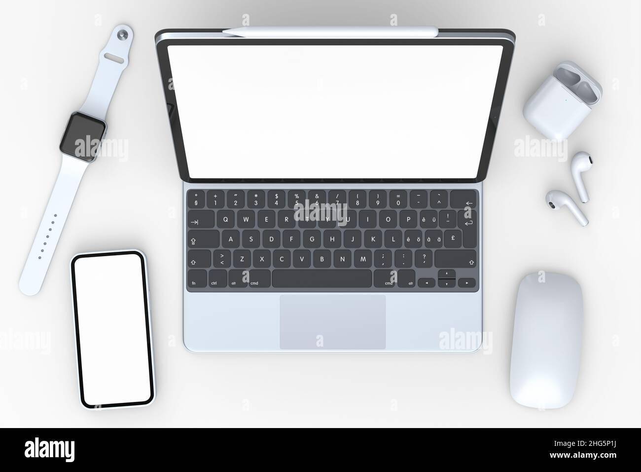 Aluminum laptop with mouse, smartwatch, phone and headphones on white ...