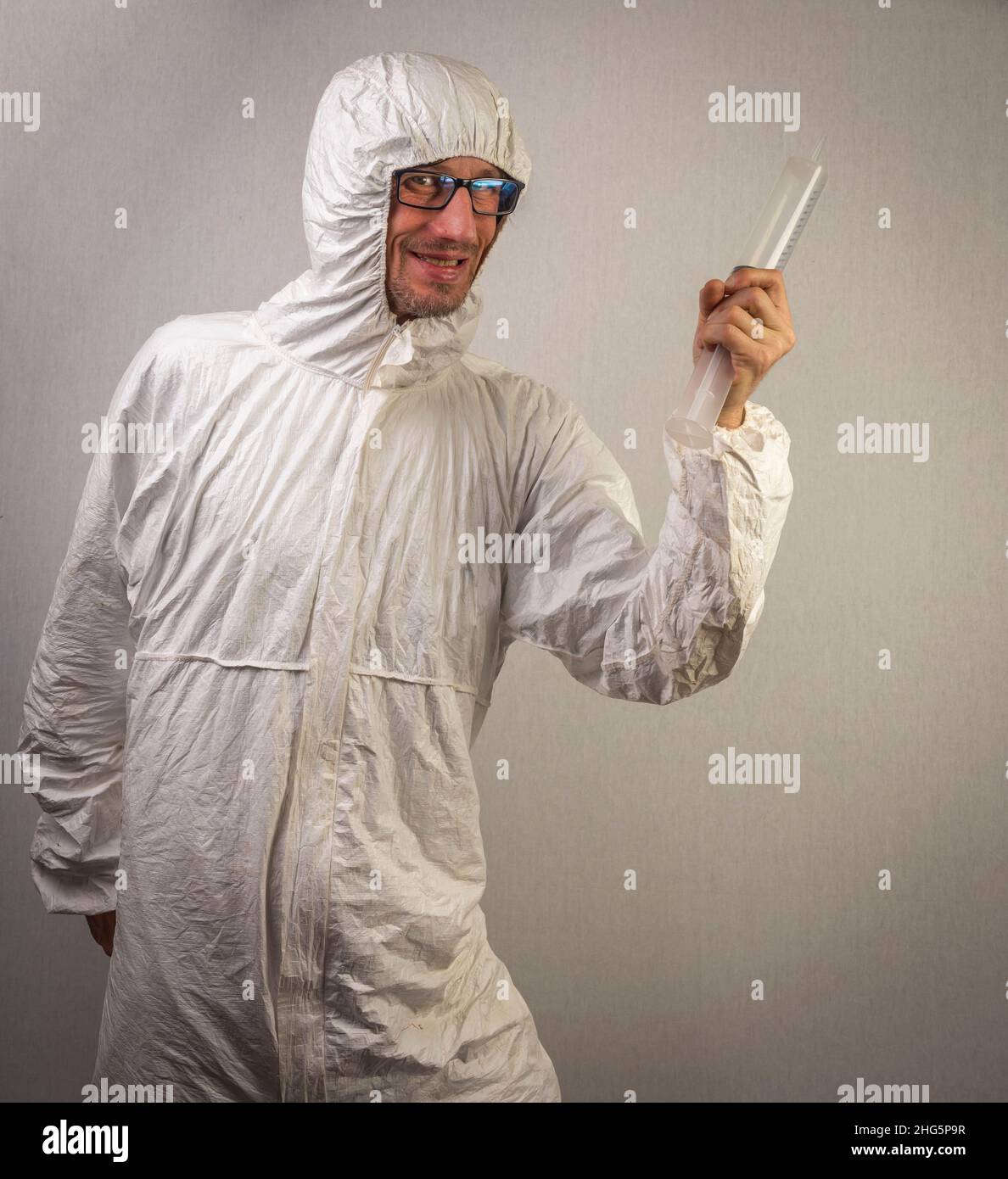 Man with white protection suit and big shot injection with white gray ...