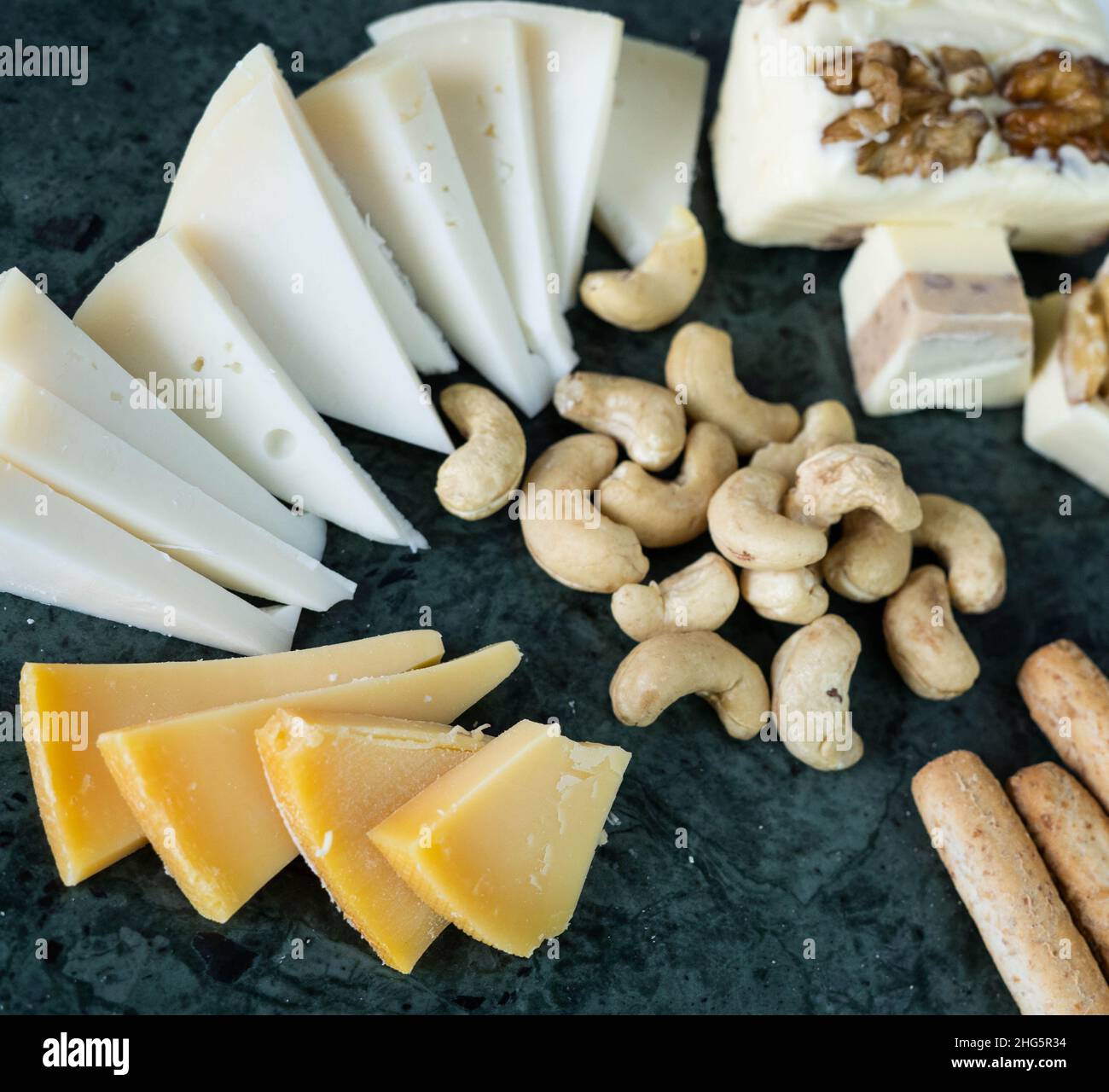 A table with varieties of ripened and soft cheeses Stock Photo - Alamy