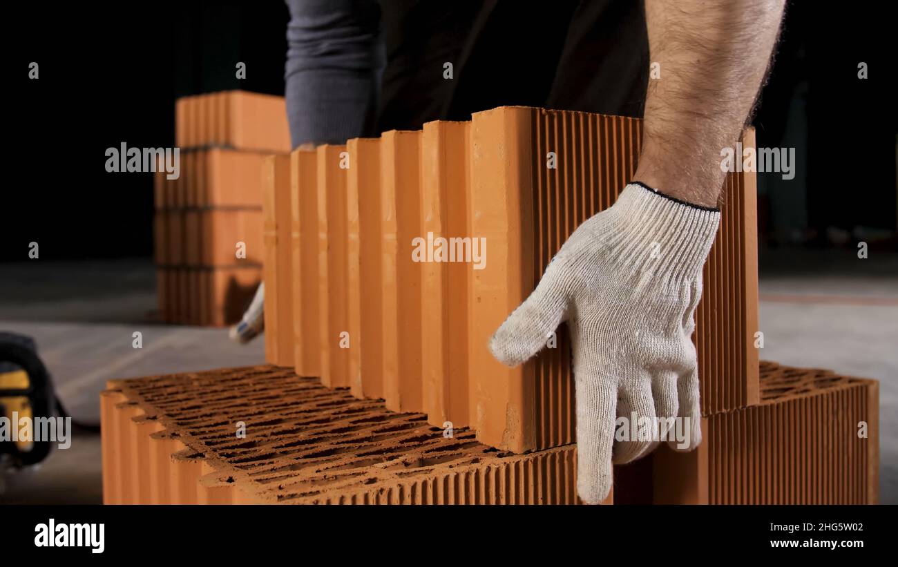 Top view of an industrial worker taking ceramic block at the ...