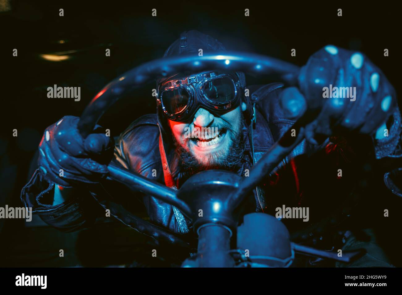 Old school retro image of crazy driver with beard wearing vintage ...