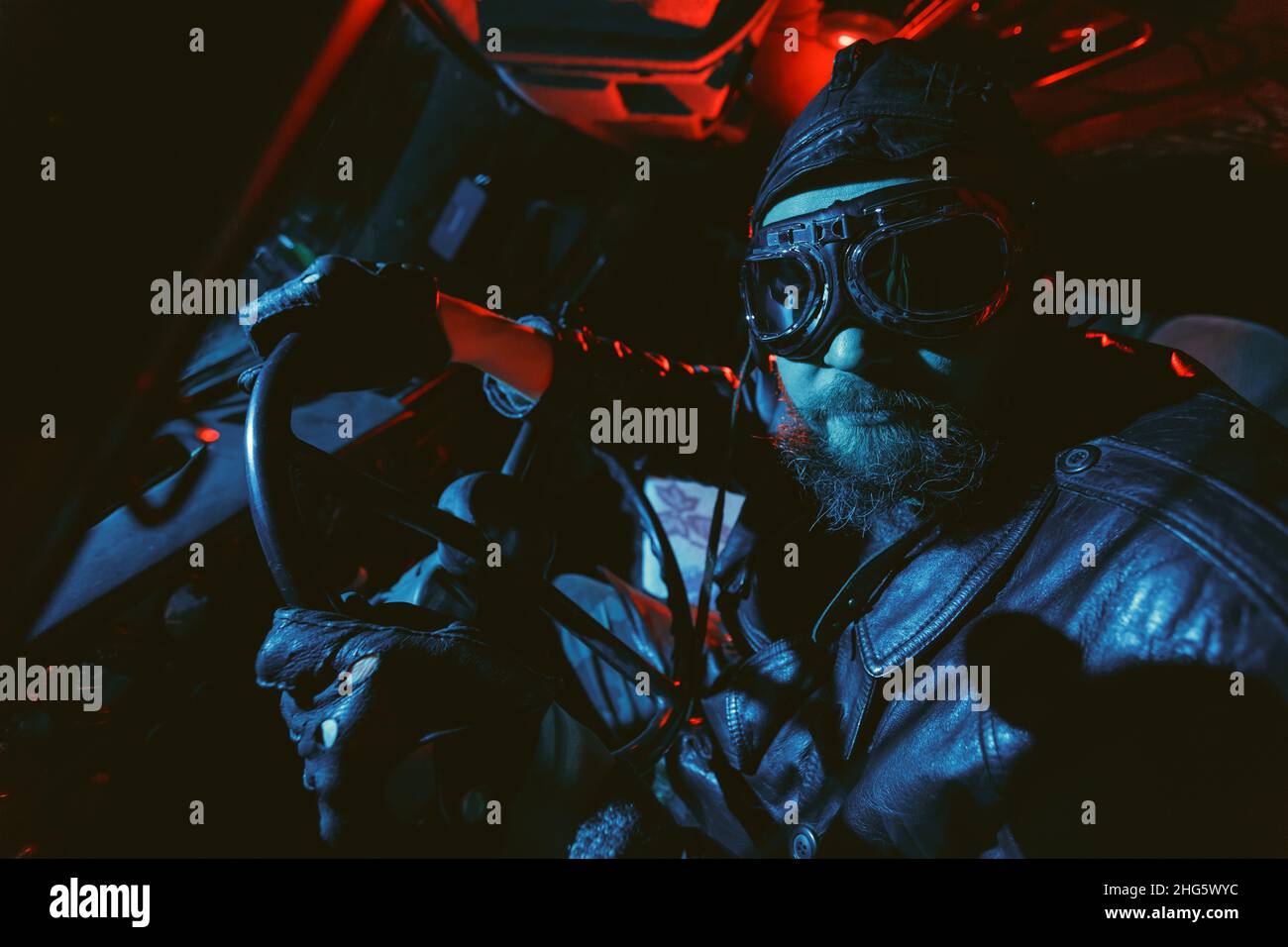 Old school retro image of crazy driver with beard wearing vintage ...