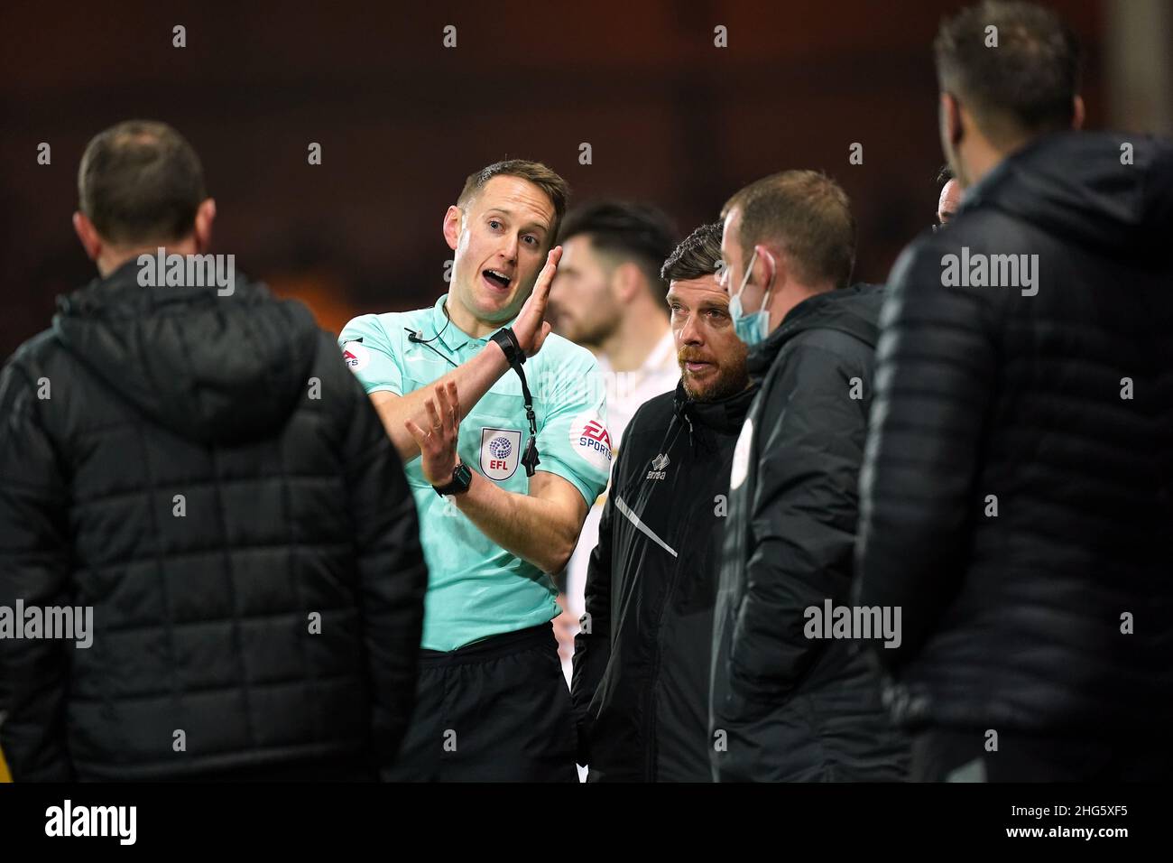 Referee James Bell explains that the goalposts have been damaged after ...