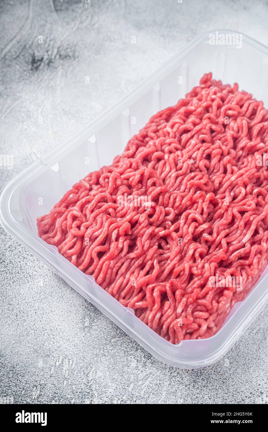 Fresh Raw mince beef and pork meat in vacuum packaging. White ...