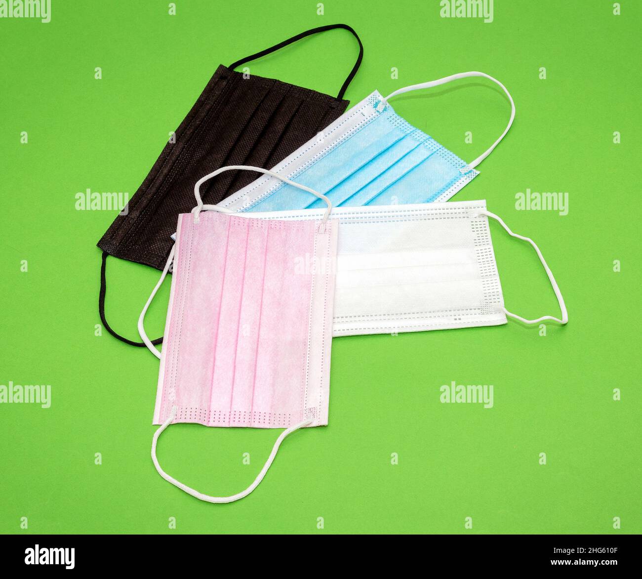 Colorful disposable surgical face masks pile for protection against ...