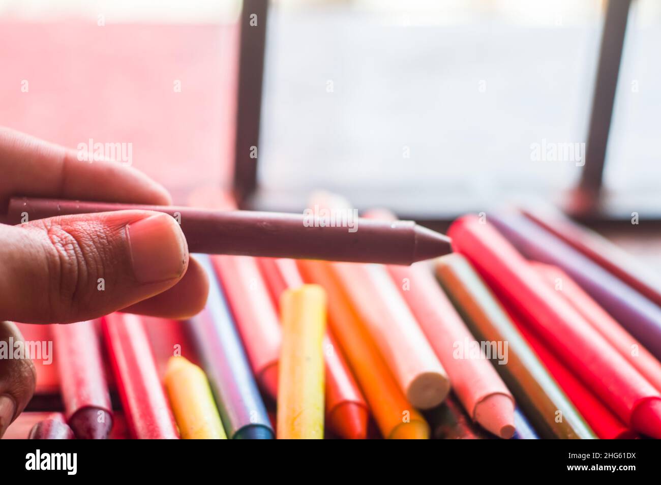 Focused crayon color diversity and hand picking up a brown crayon ,copy ...