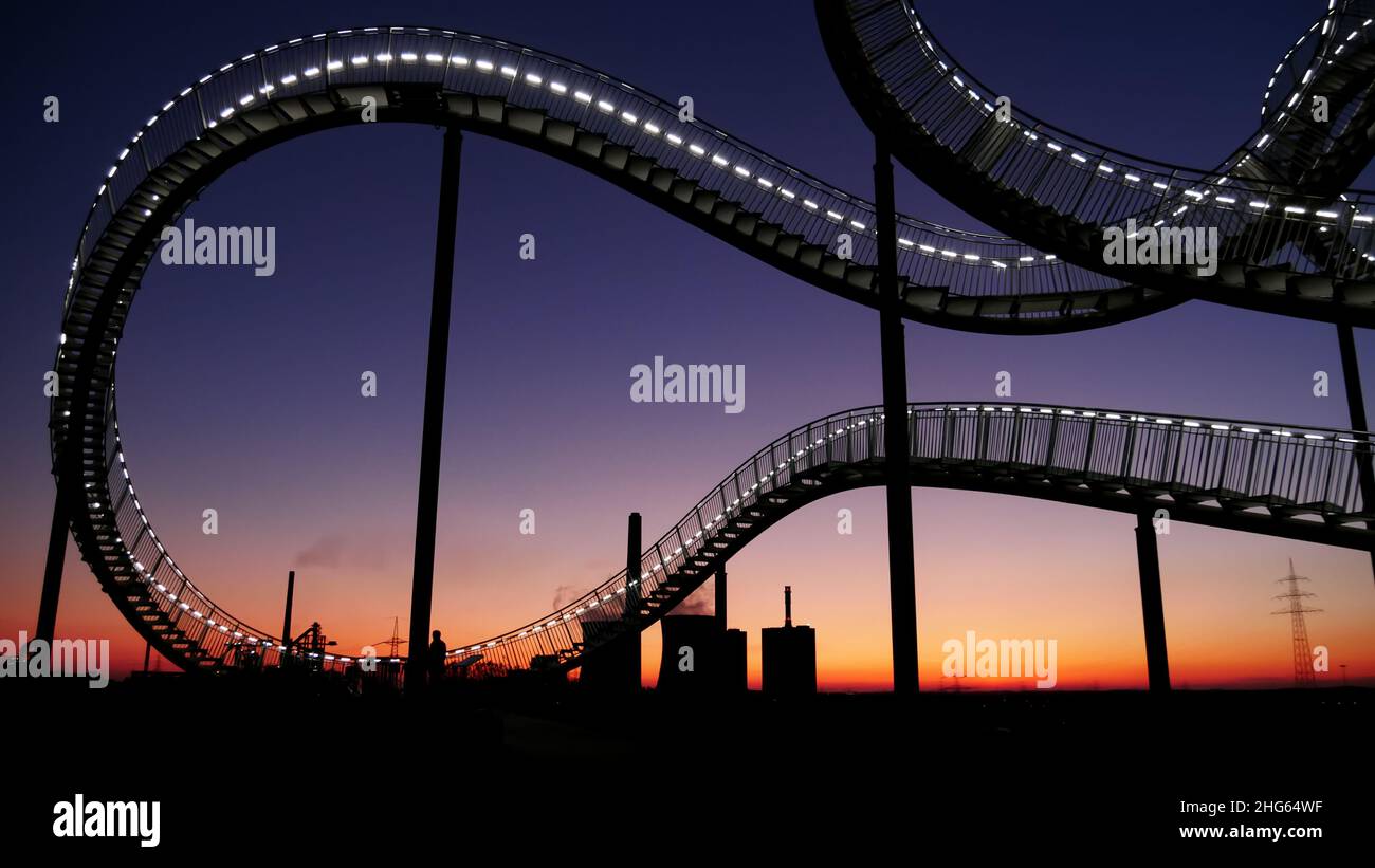 Tiger Turtle Magic Mountain at sunset in Duisburg, Germany Stock Photo ...