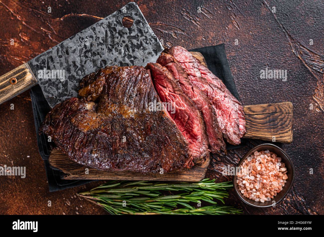 Roasted hanging tender or Onglet sliced beef meat steak on a butcher ...