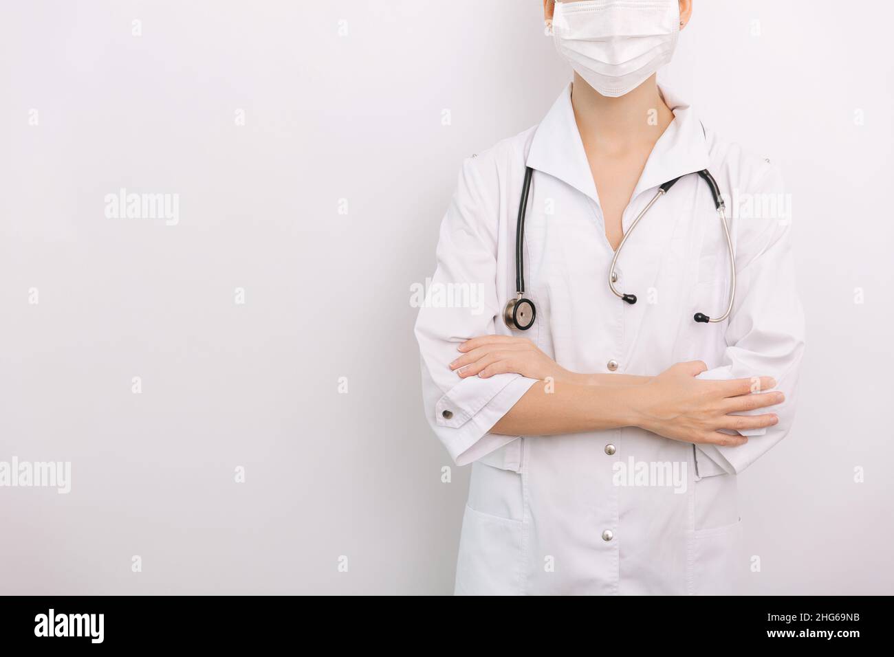 Doctor with stethoscope in medical coat on white background. Front ...