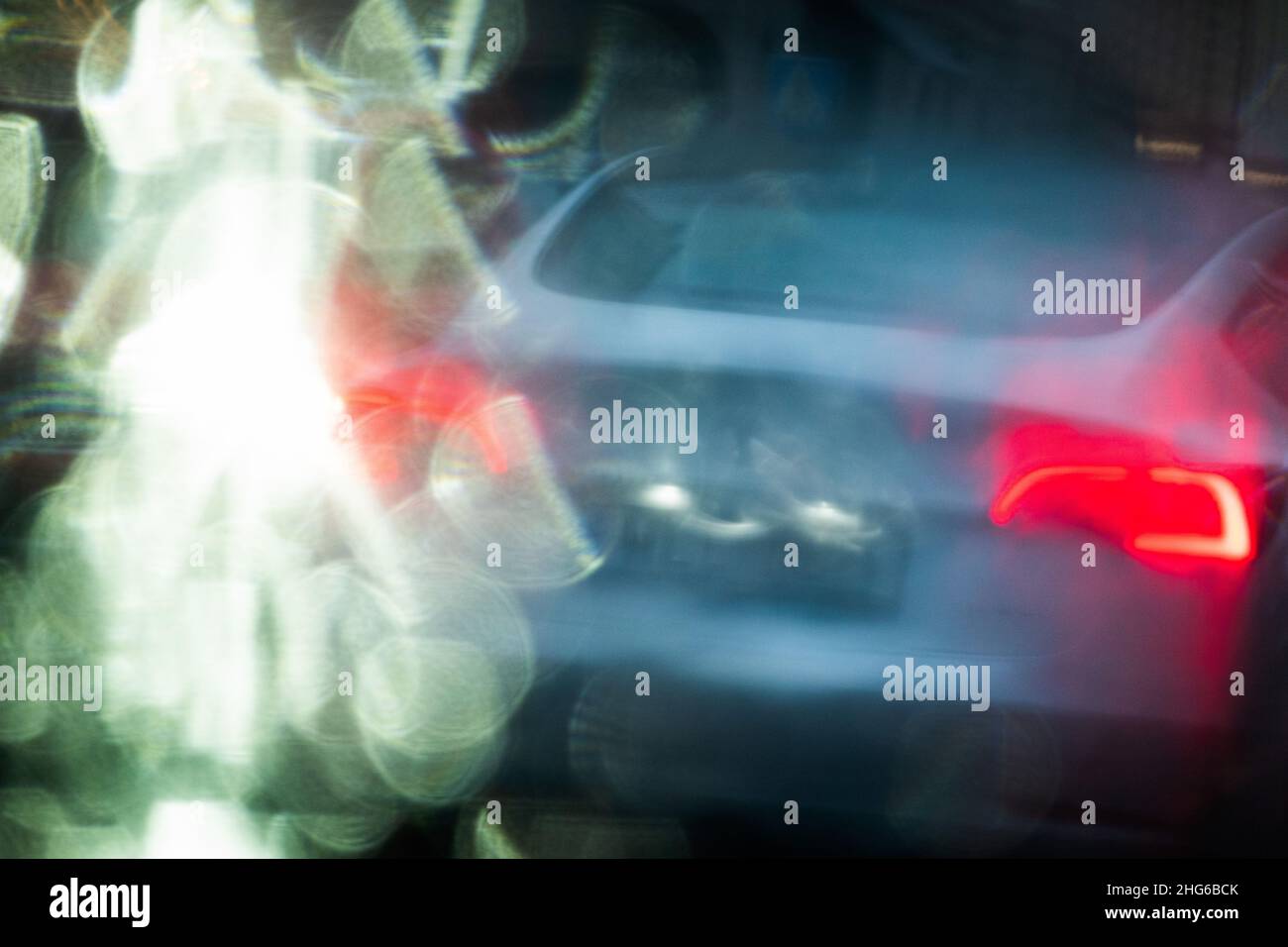 Messy traffic situations shot through rainy window Stock Photo - Alamy