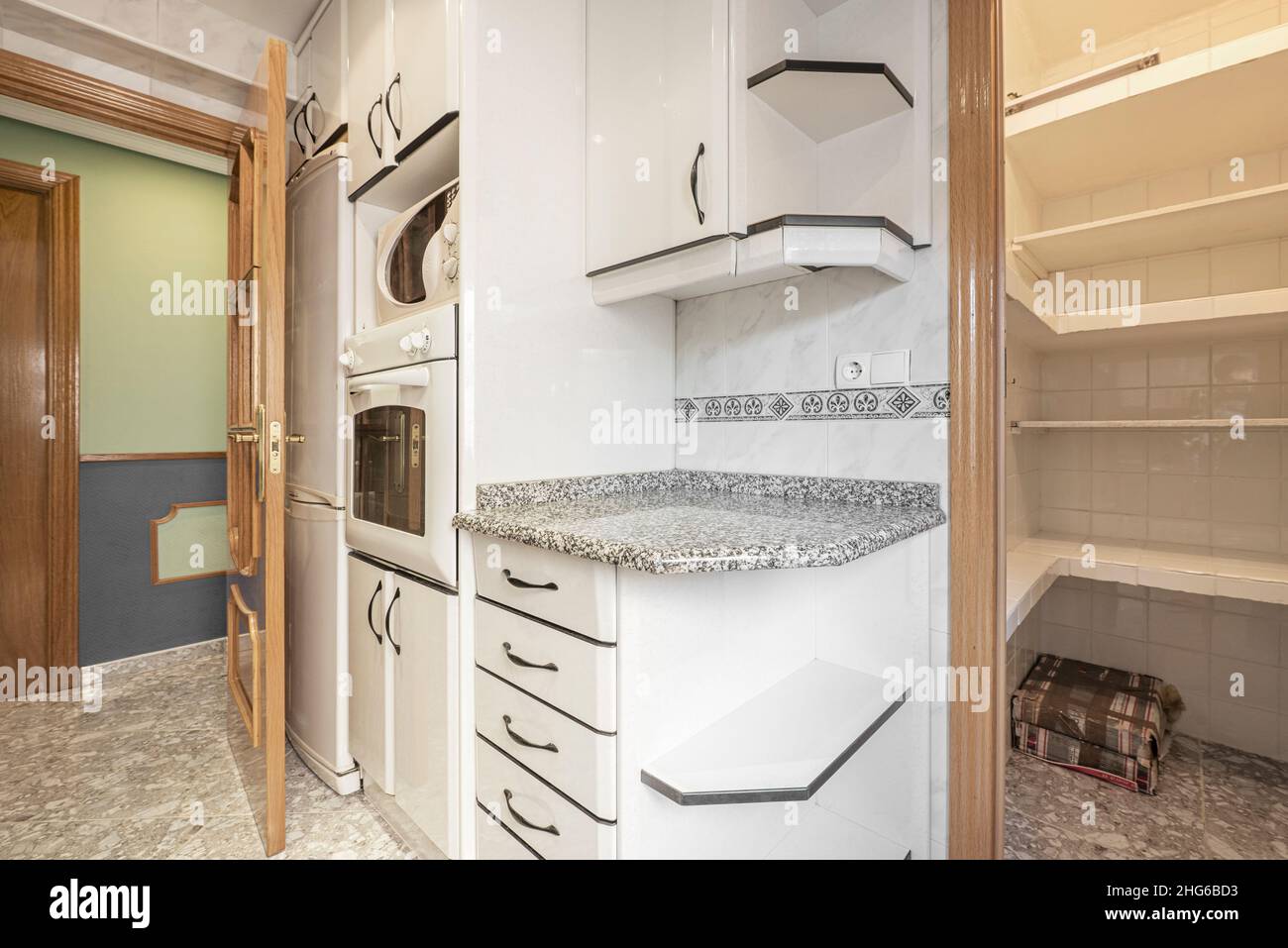 Kitchen with granite countertops, imitation marble ceramic floors and ...