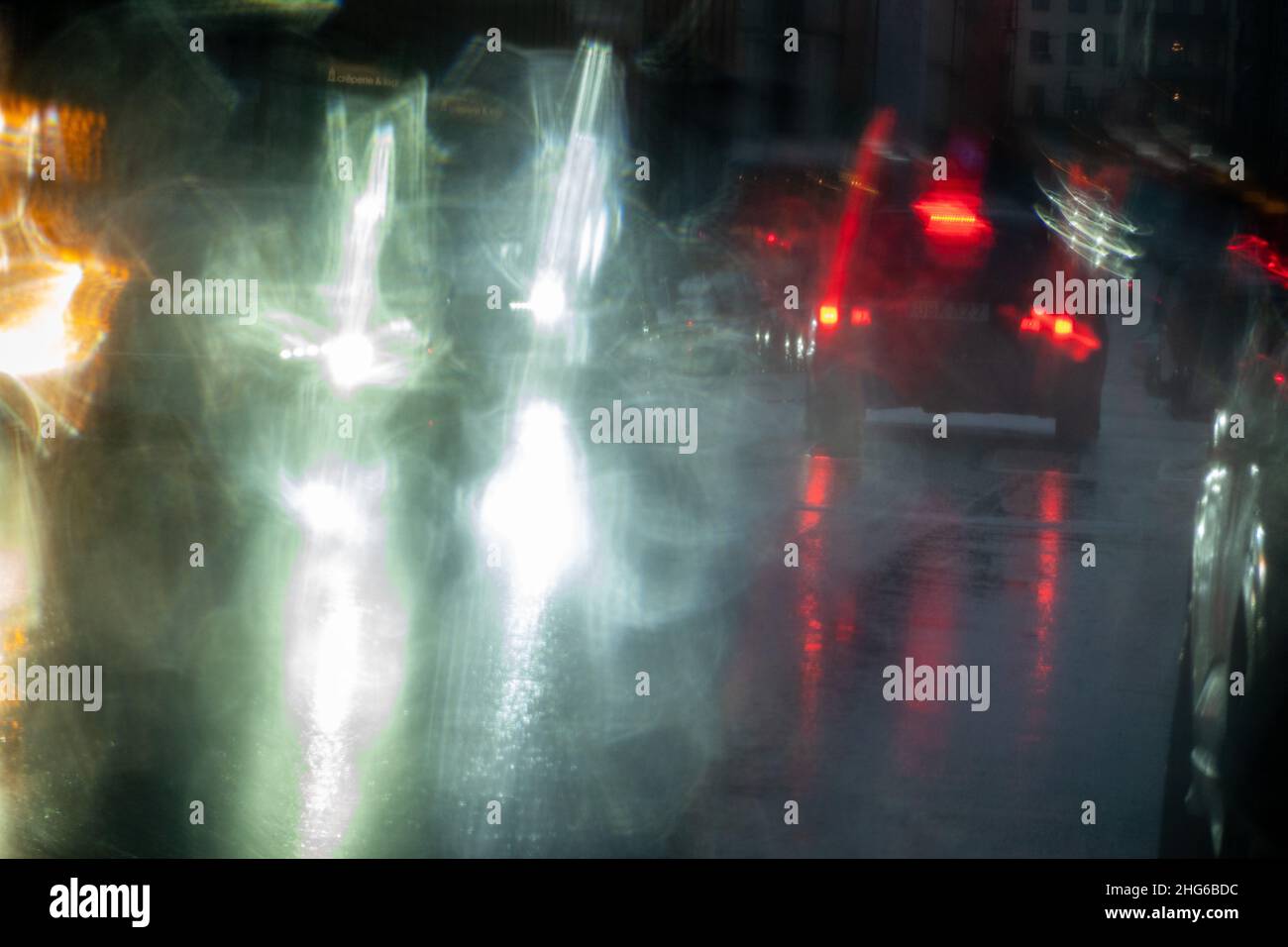 Messy traffic situations shot through rainy window Stock Photo - Alamy