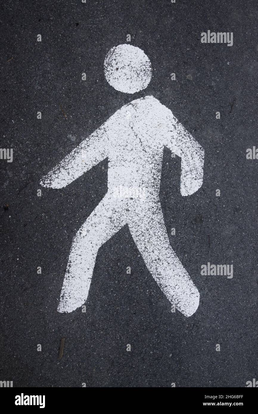 Image of a traffic sign in the shape of a pedestrian painted on the ...