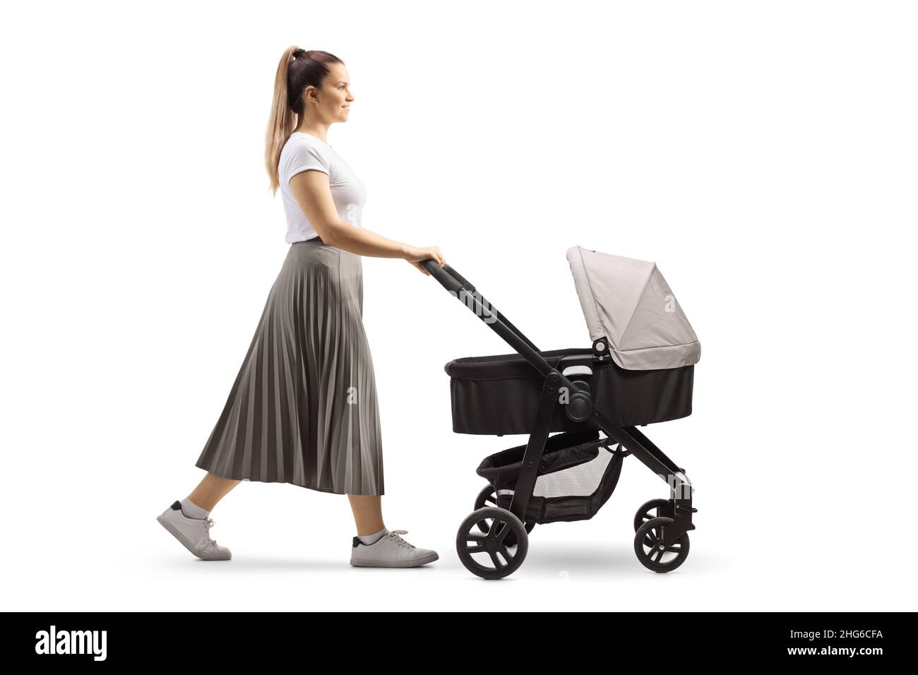 Full length profile shot of a young mother pushing a baby stroller ...