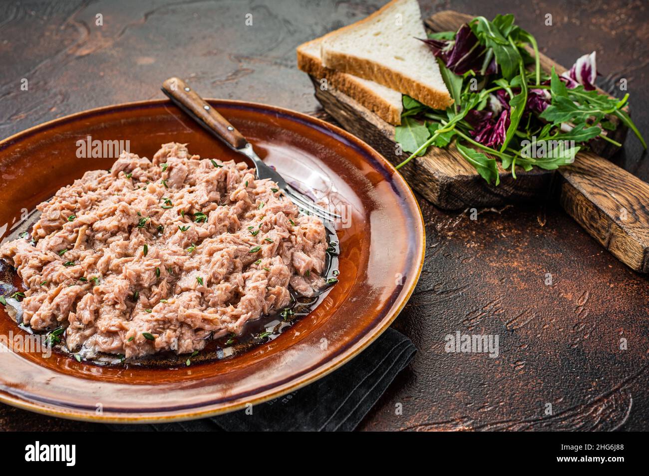 Tuna canned fish with bread and salad. Dark background. top view Stock ...