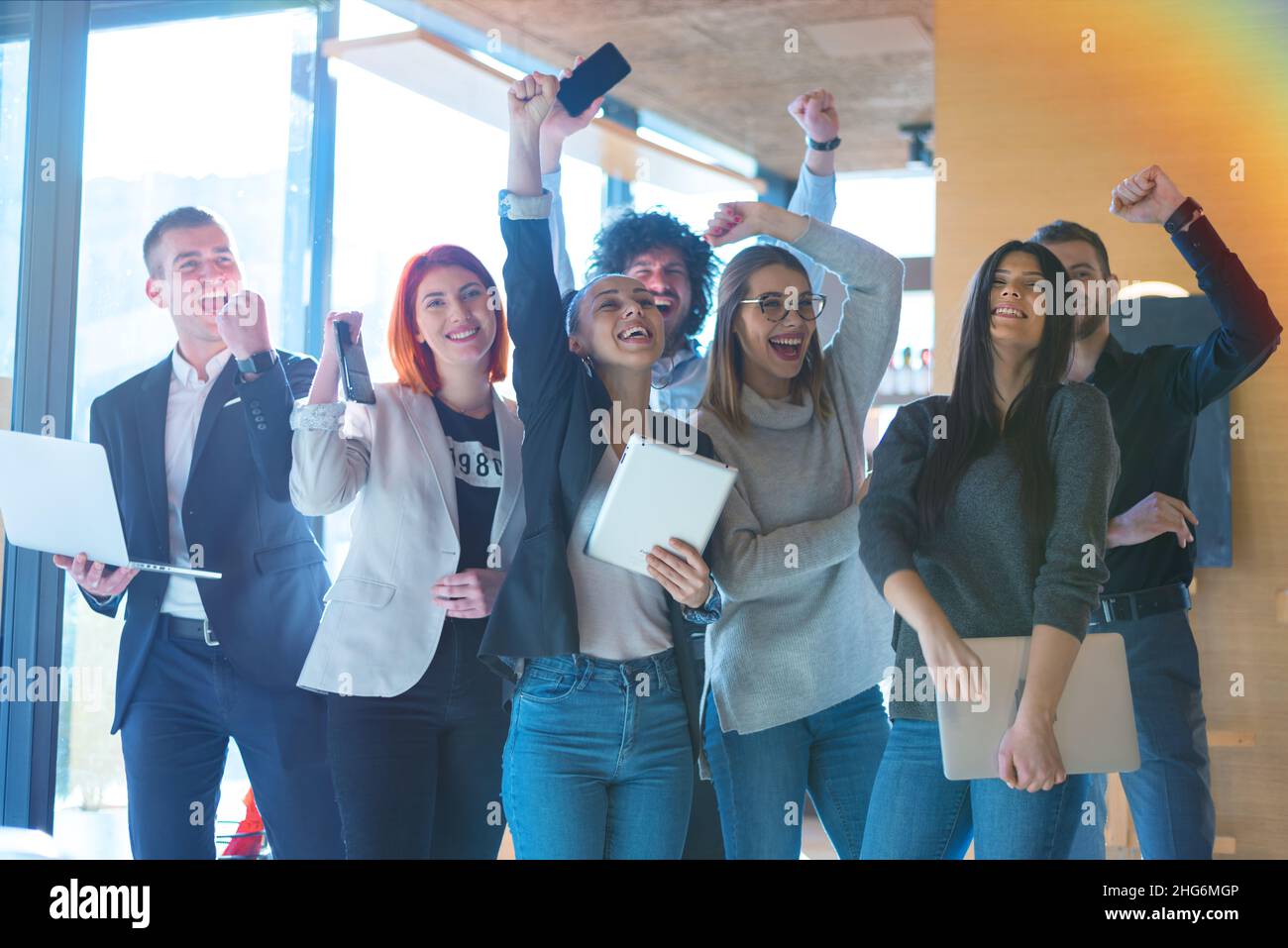 Successful young creative business team celebrating their success Stock ...