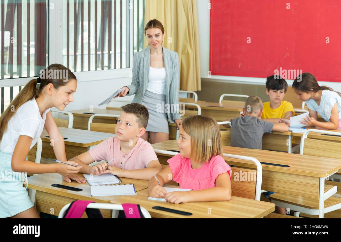 Children performing group tasks Stock Photo - Alamy