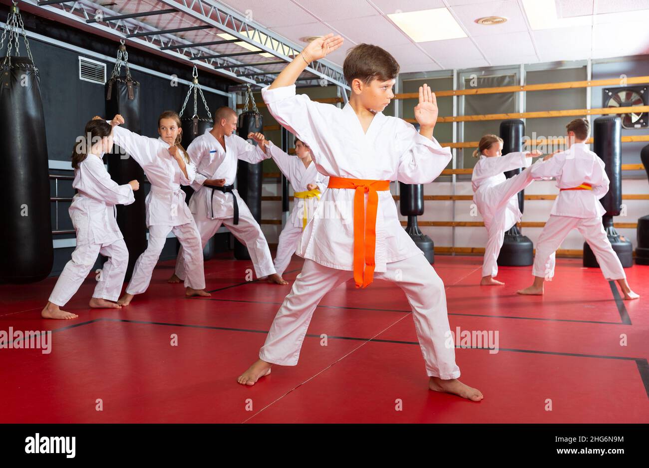 Boy practicing new moves during karate class Stock Photo - Alamy
