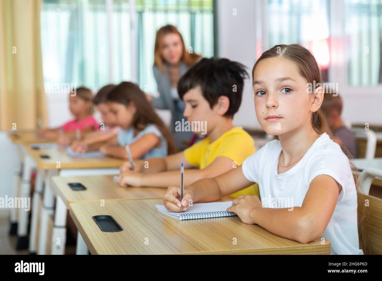 Kids studying in classroom Stock Photo - Alamy